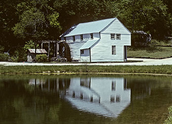 Zanoni Mill (restored 1905) with overshot waterwheel in Ozark county in ...